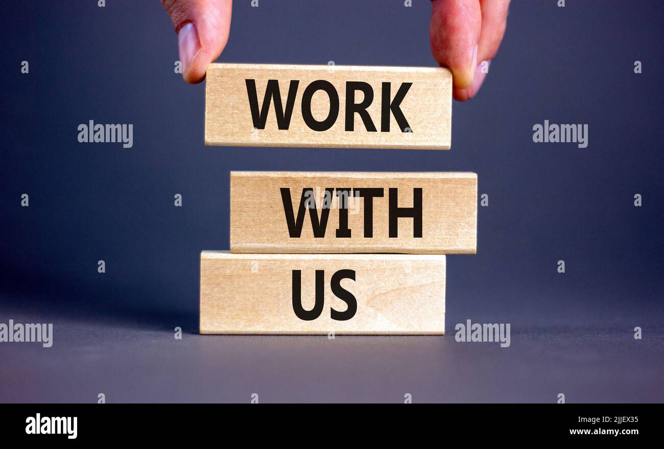 Work with us symbol. Concept words Work with us on wooden blocks on a ...
