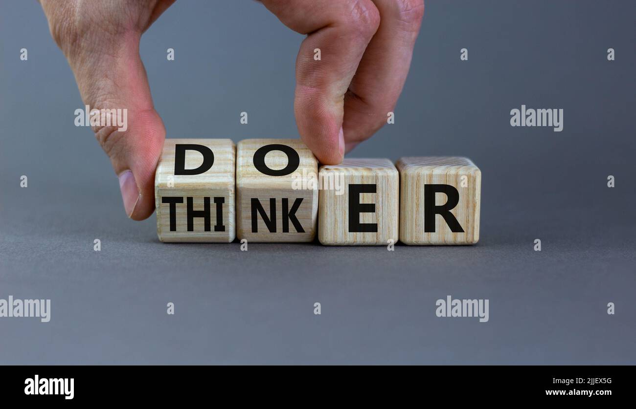 Doer or thinker symbol. Concept words Doer or thinker on wooden cubes ...
