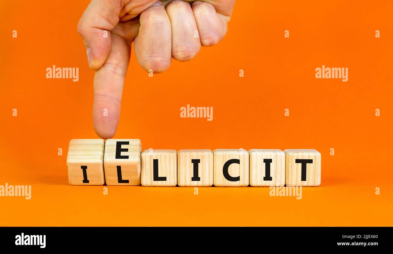 Illicit or elicit symbol. Businessman turns wooden cubes and changes ...