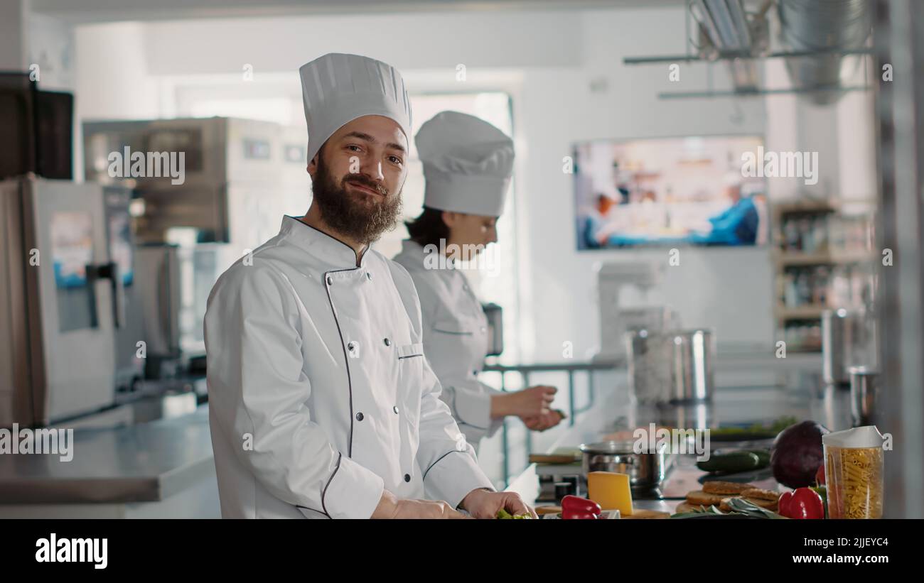 Authentic portrait of professional chef preparing celery for gourmet ...