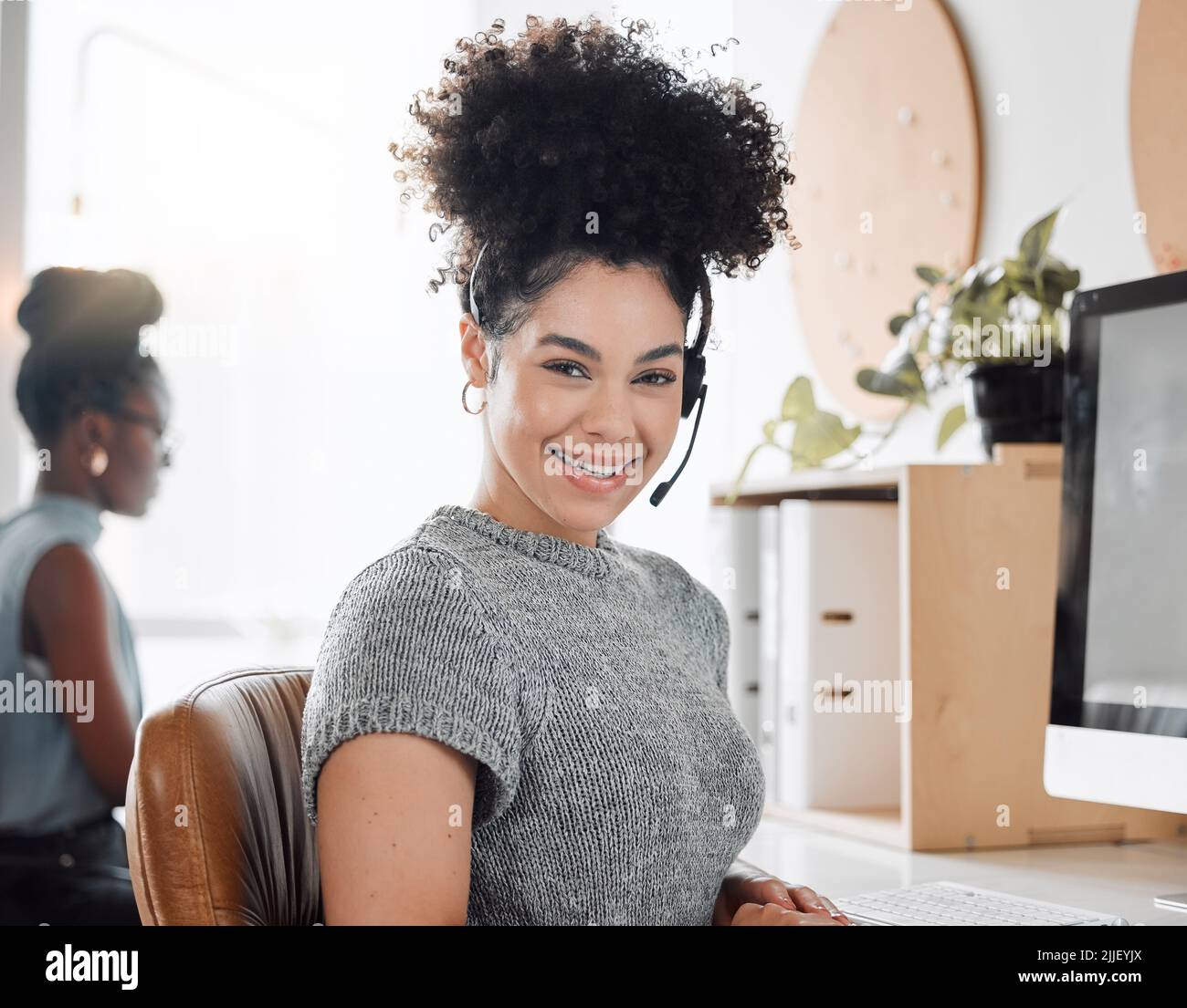I can assist with whatever you need. Portrait of a young call centre ...