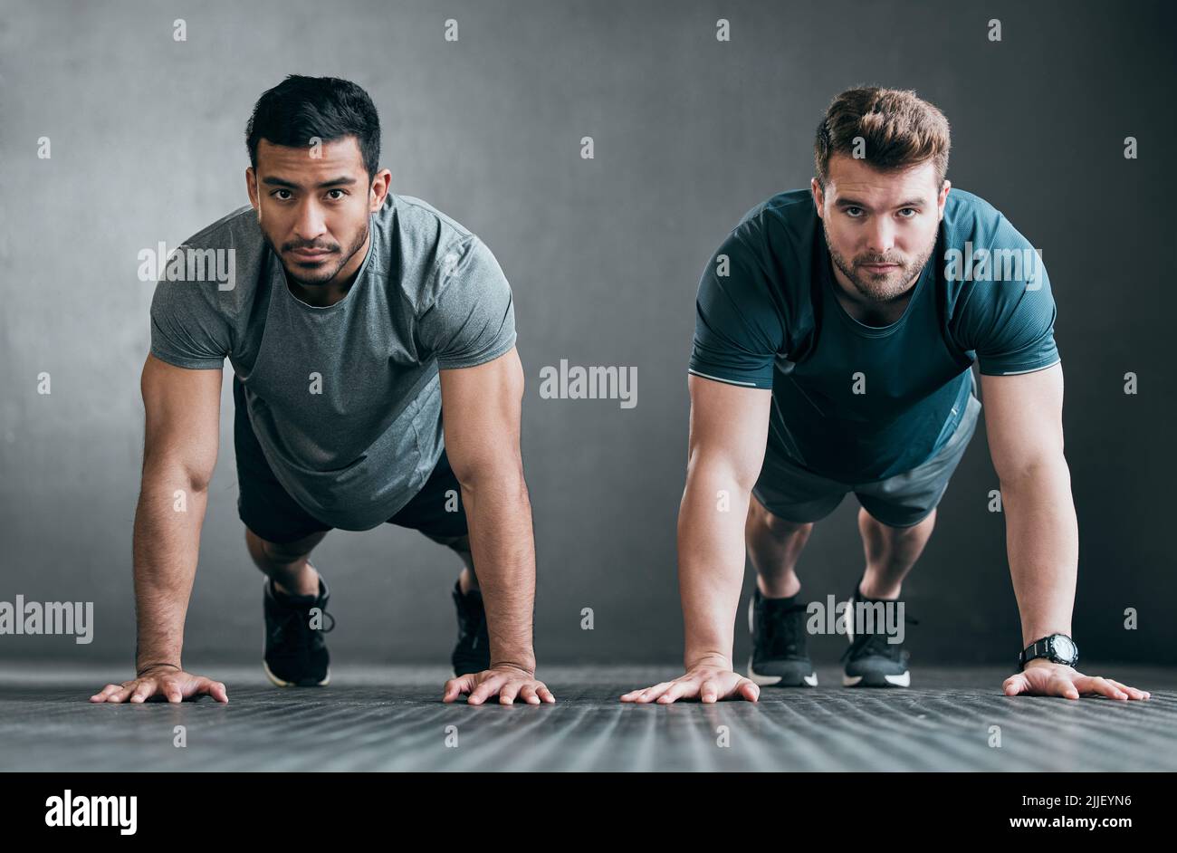 Who can hold it the longest. Full length portrait of two handsome young ...