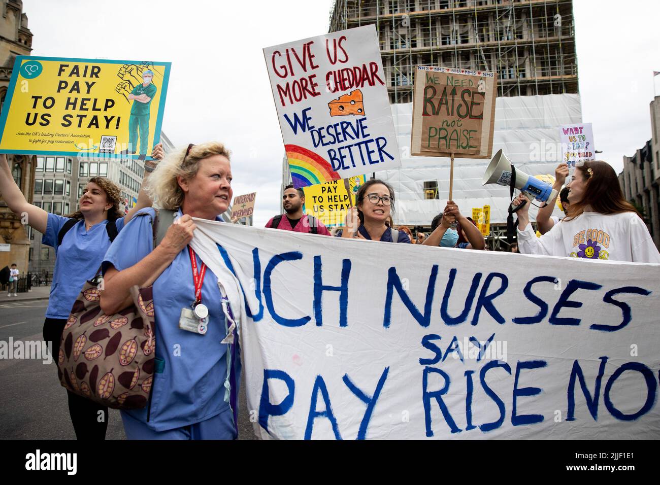 Healthcare professionals including doctors and nurses seen chanting ...
