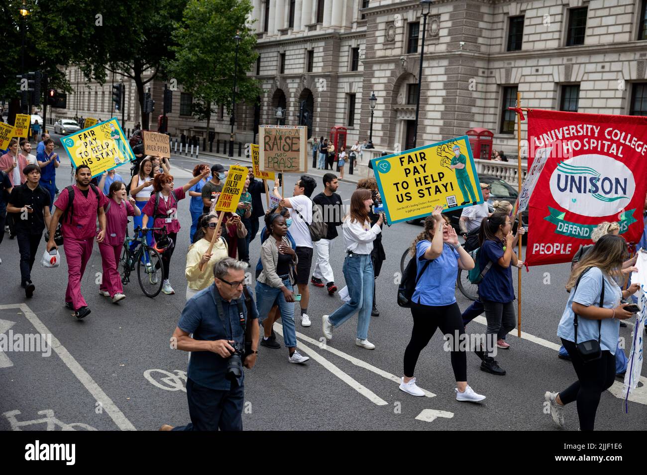Healthcare professionals including doctors and nurses seen chanting ...