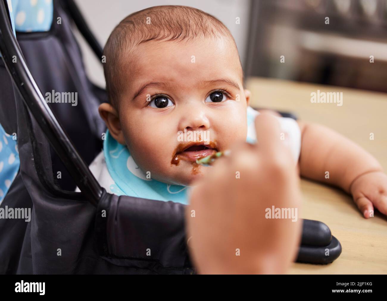 Am I hungry Always. a mother feeding her adorable baby boy Stock Photo ...