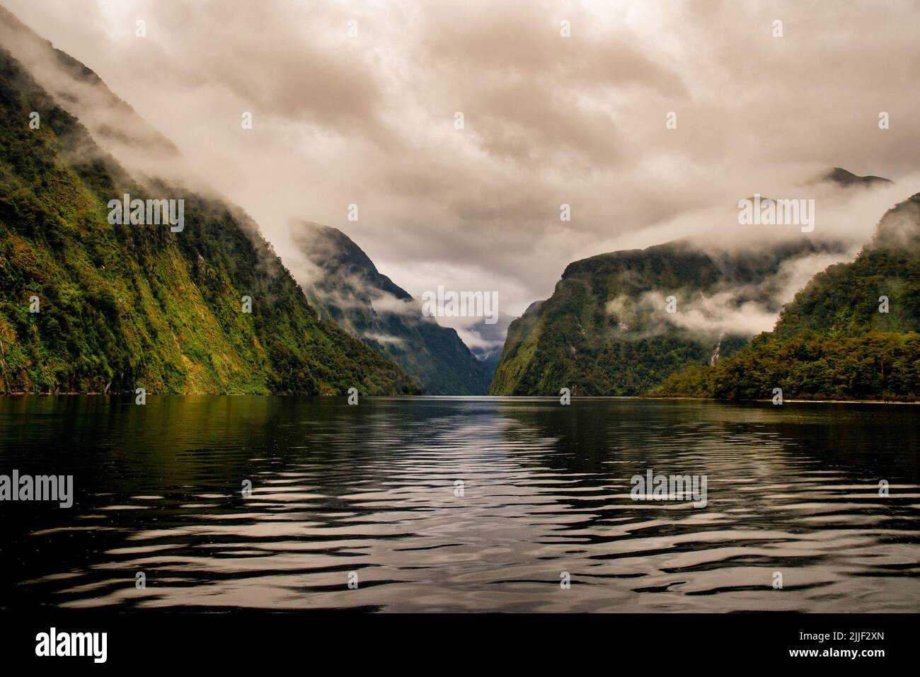 The dramatic atmospheric magic of Doubtful Sound in cloudy rainy ...
