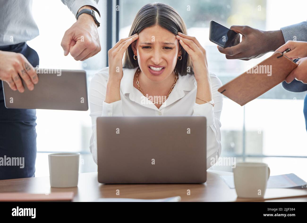 Todays just not my day. a young businesswoman feeling stressed out in a ...