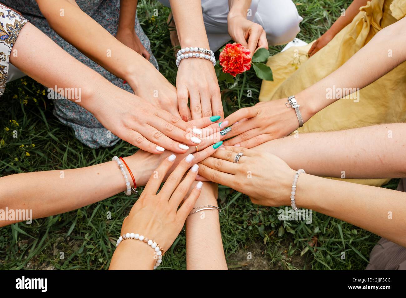 Multiracial group of friends with hands in stack. Teamwork Stock Photo ...
