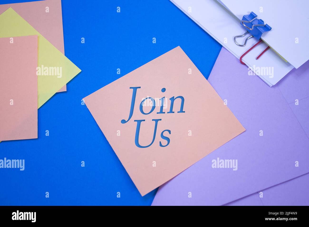 Join Us. Text on adhesive note paper. Event, celebration reminder ...