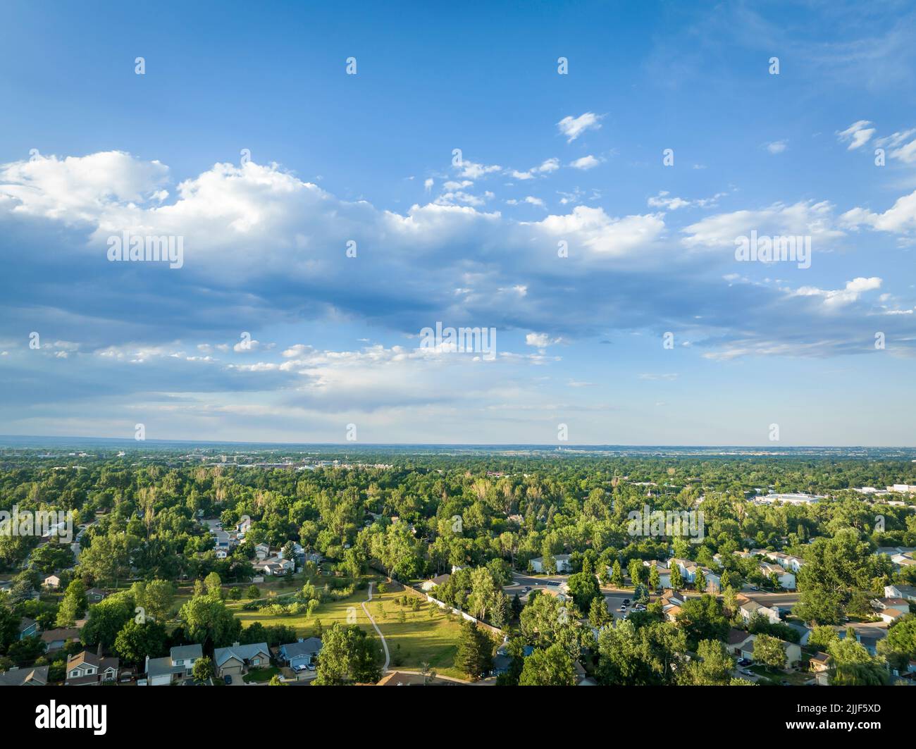 summer afternoon over residential area and park of Fort Collins in ...