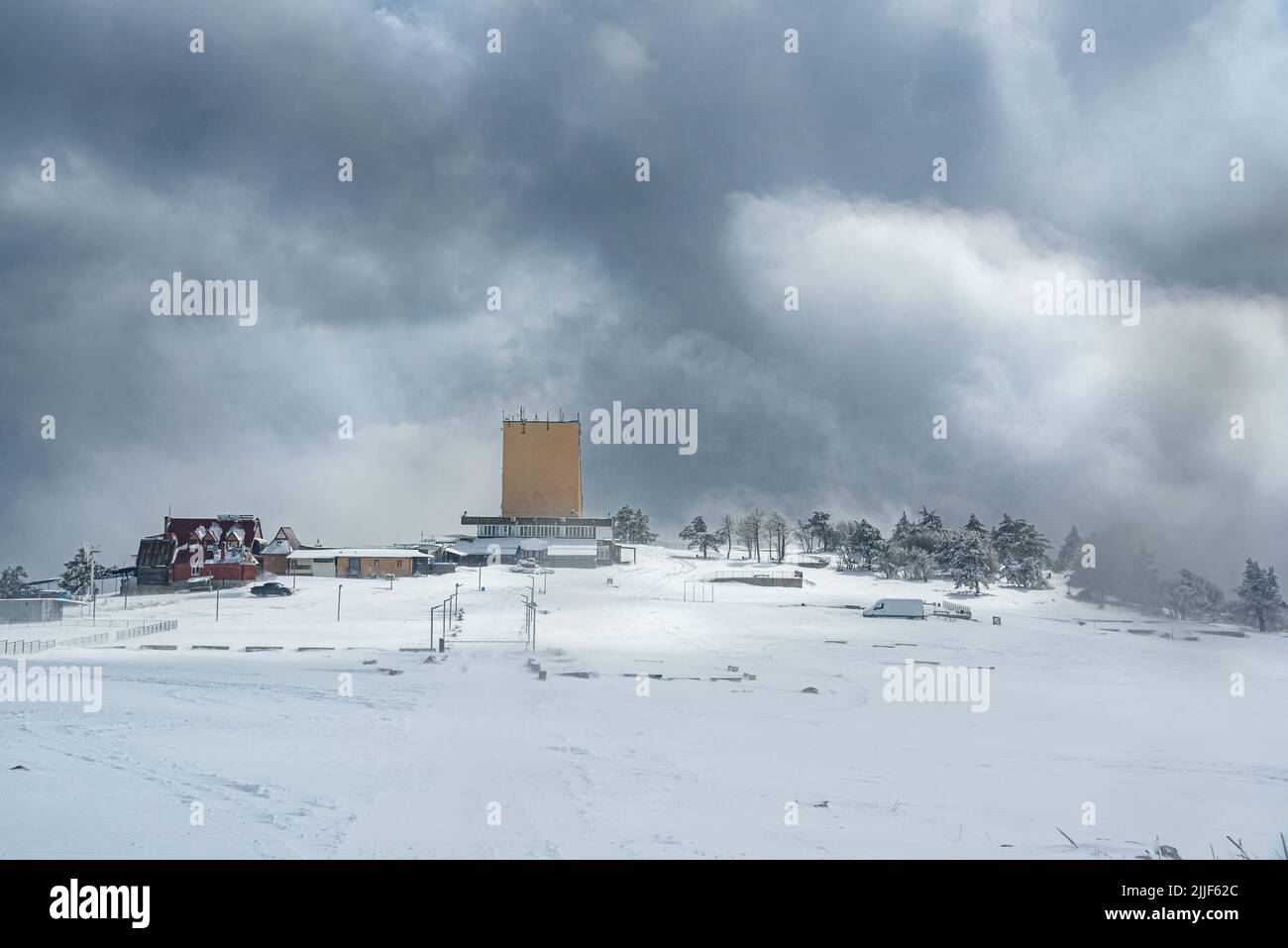 Snow covered forest and upper station on top of mountain Ai-Petri after ...