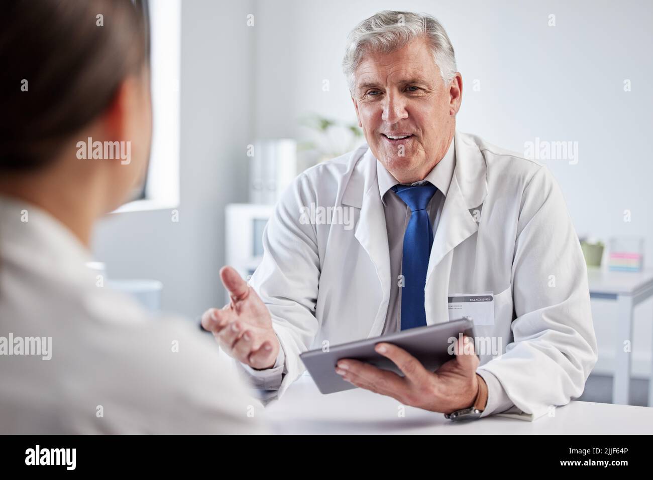 How are you feeling today. a mature male doctor having a consultation ...