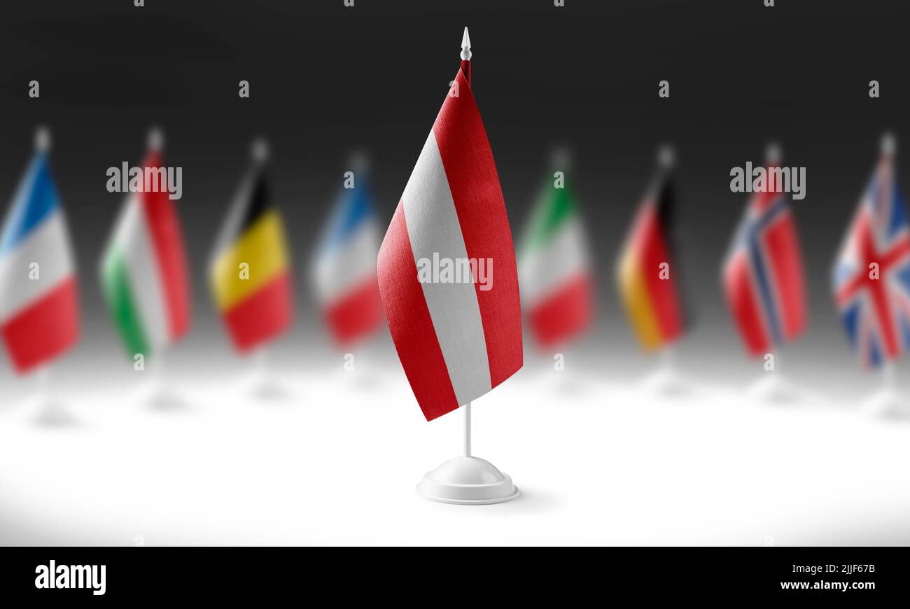 The national flag of the Austria on the background of flags of other ...