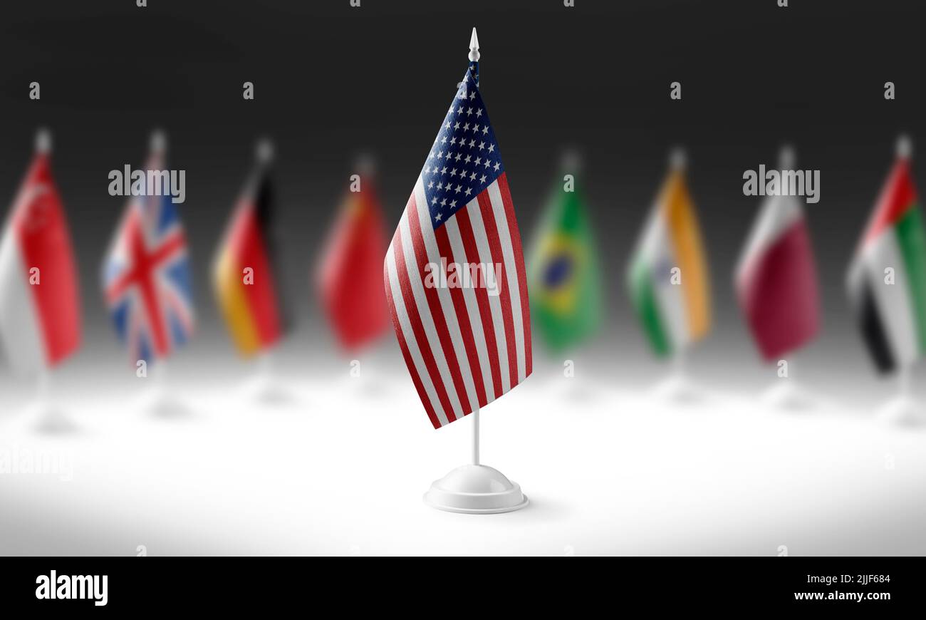The national flag of the USA on the background of flags of other ...
