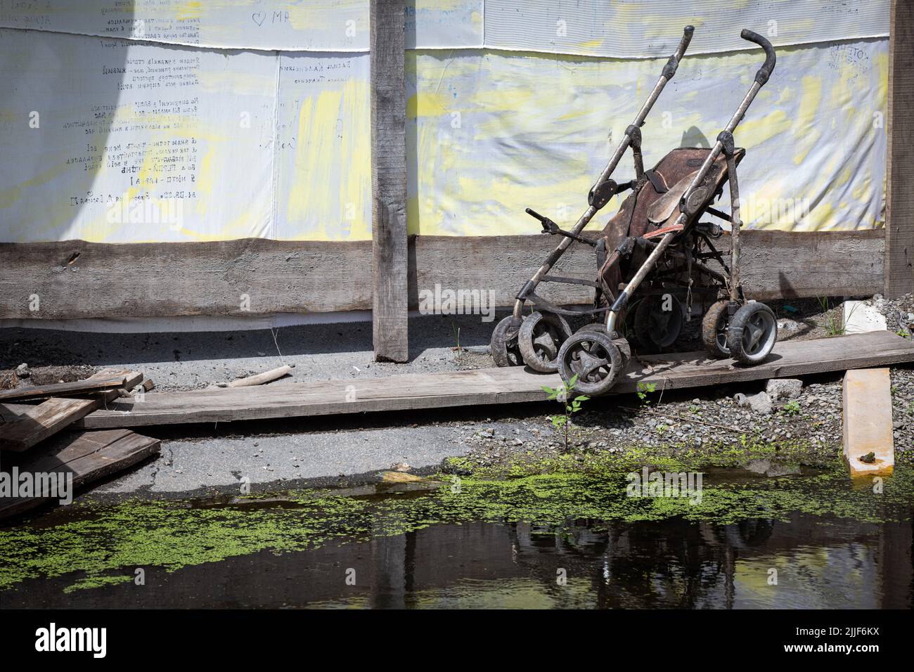 Baby stroller on the bridge across the Irpin river was lost during the ...