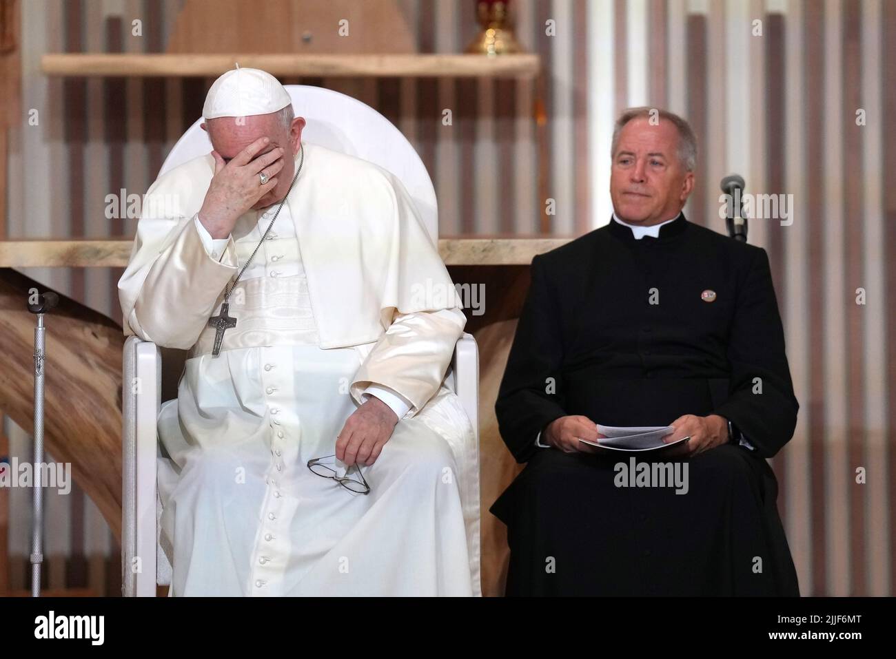 Pope Francis bows his head during a service at the Sacred Heart Church ...