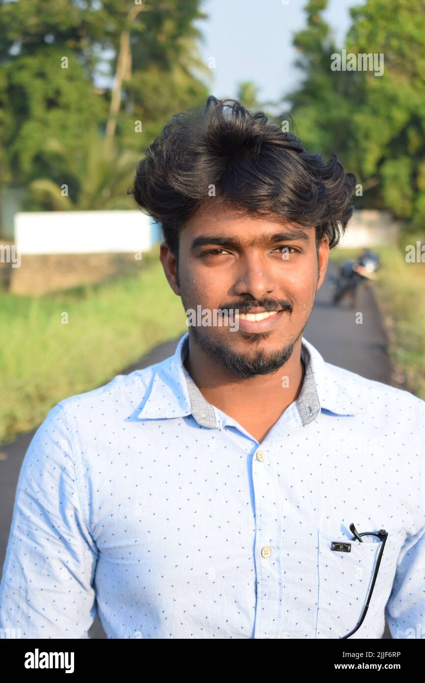 Indian man standing happy hi-res stock photography and images - Alamy