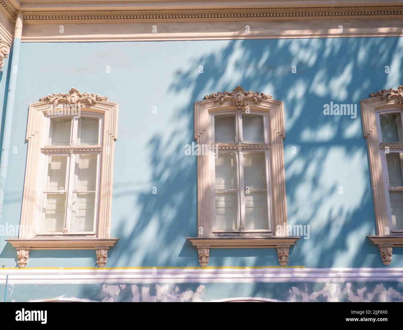 Decorative windows of old building Stock Photo - Alamy