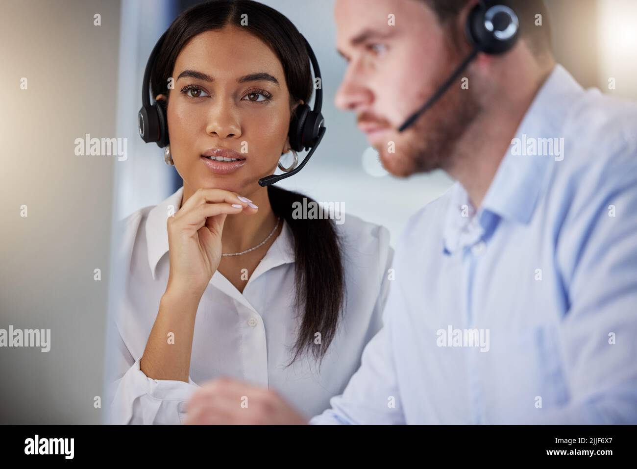 Lets troubleshoot this together. two call centre agents working ...