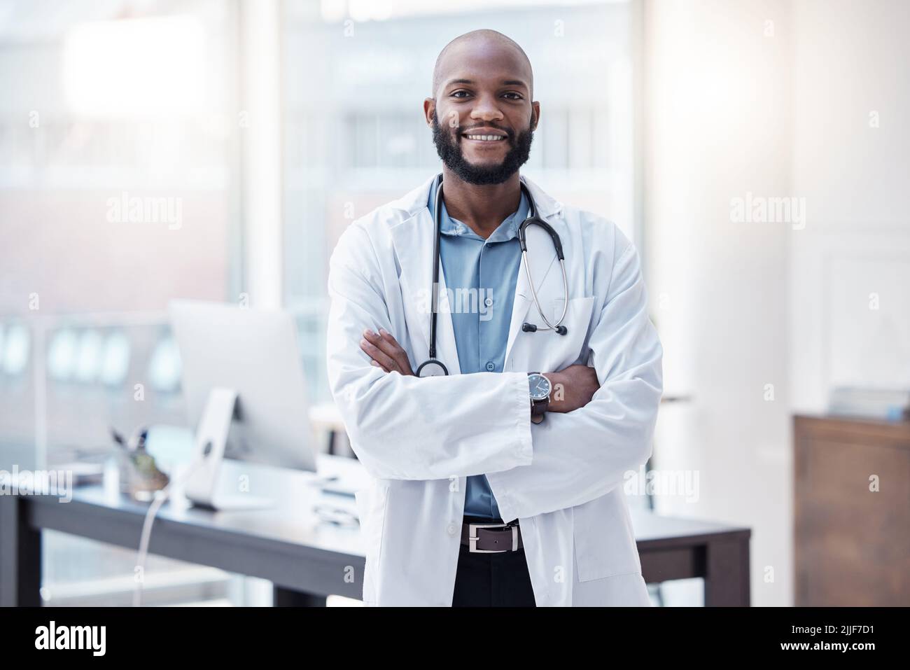 Science is the tree of wisdom. a young doctor standing alone with his ...