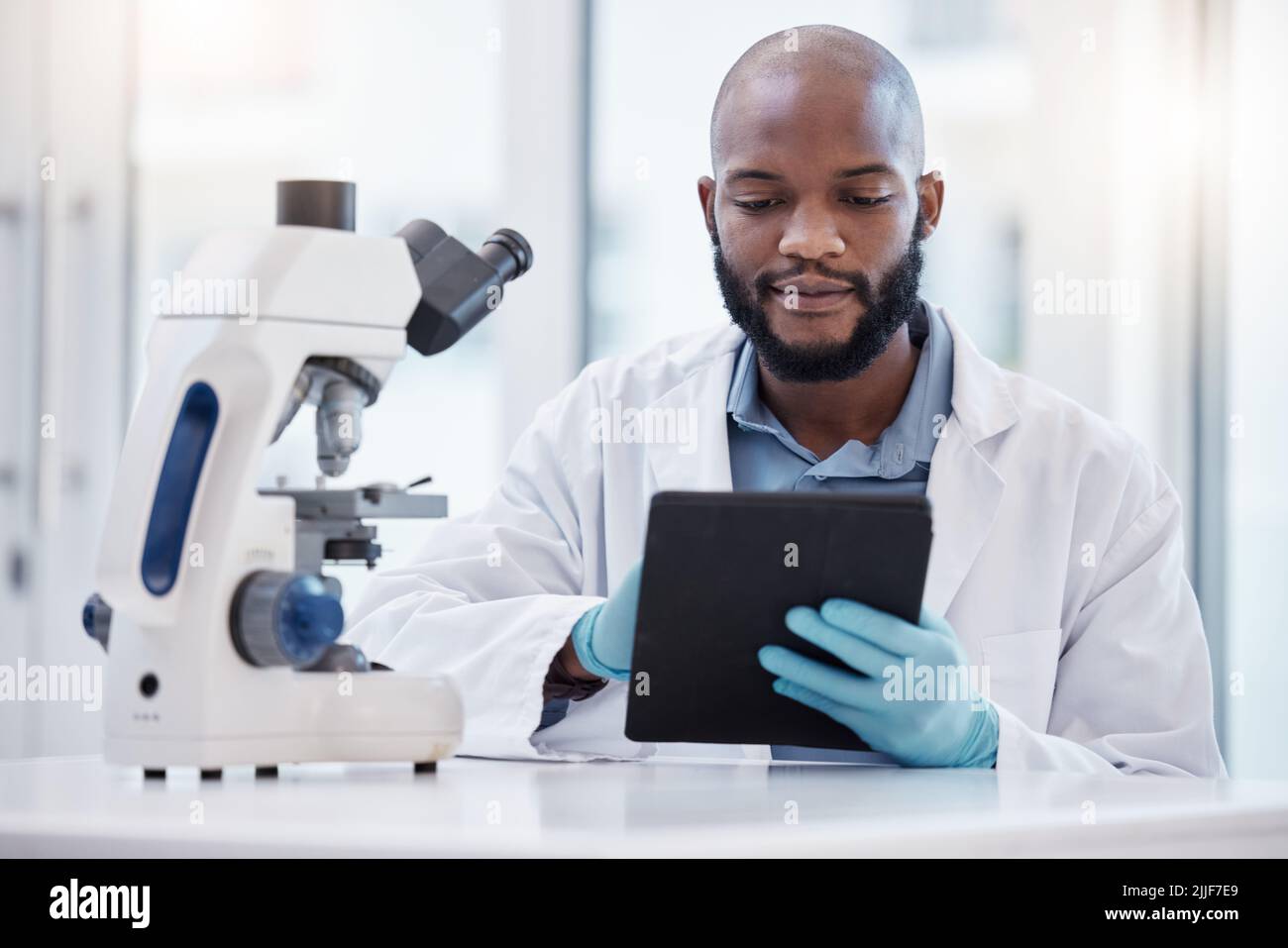 Scientists have become the bearers of the torch. Shot ofa a young man ...