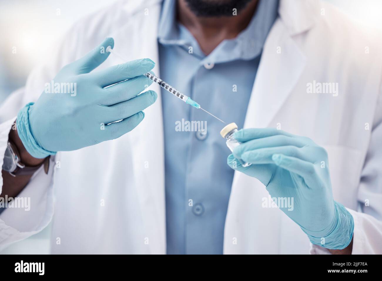 Progress is made by trial and failure. a unrecognizable scientist using ...