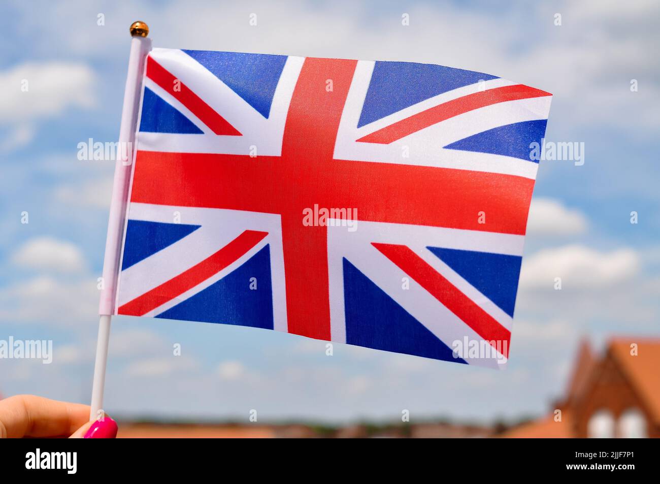 The national union jack flag of Great britain red white and blue colors ...