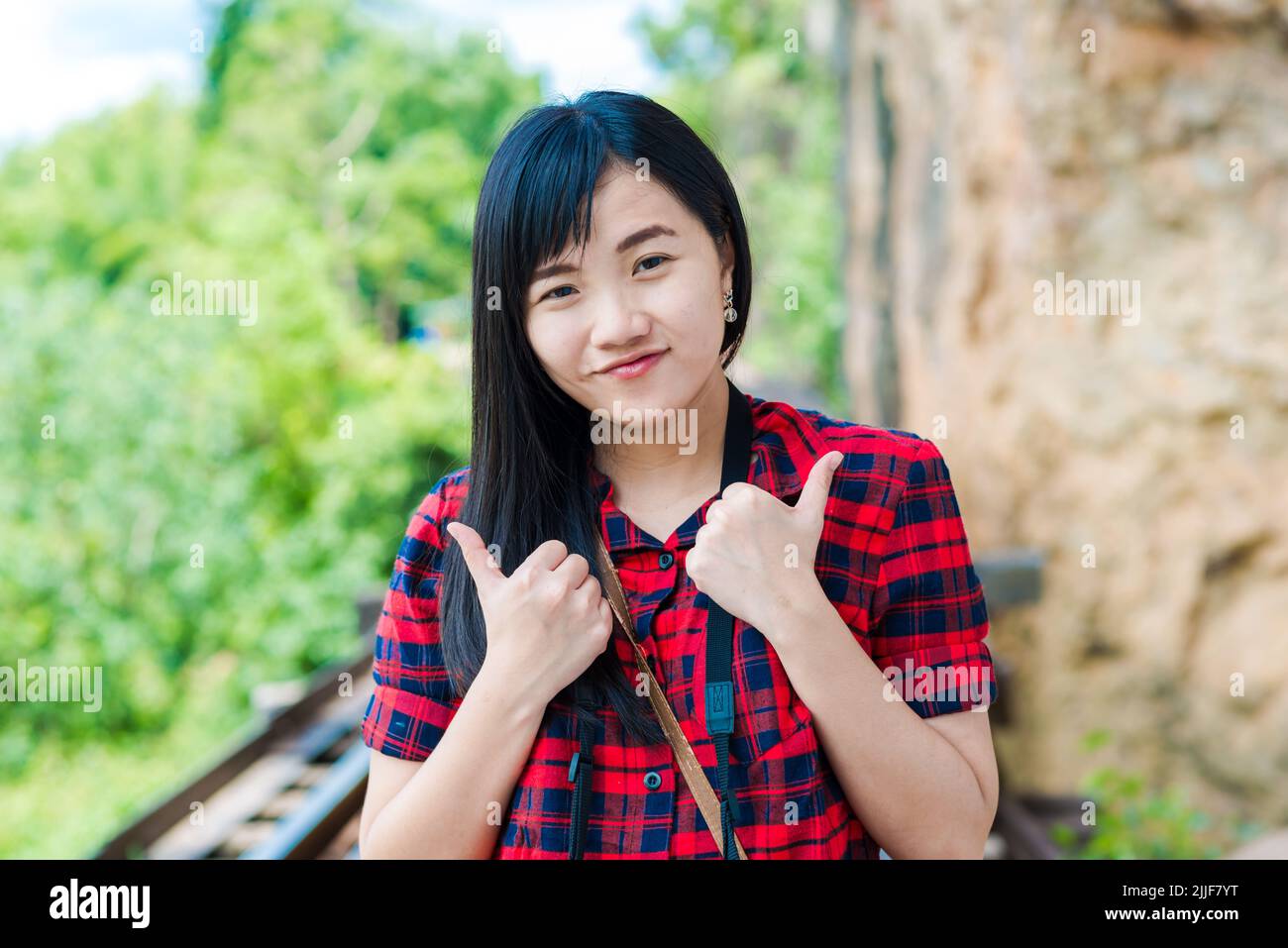 Beautiful asian women smiling at green park outdoor nature background ...