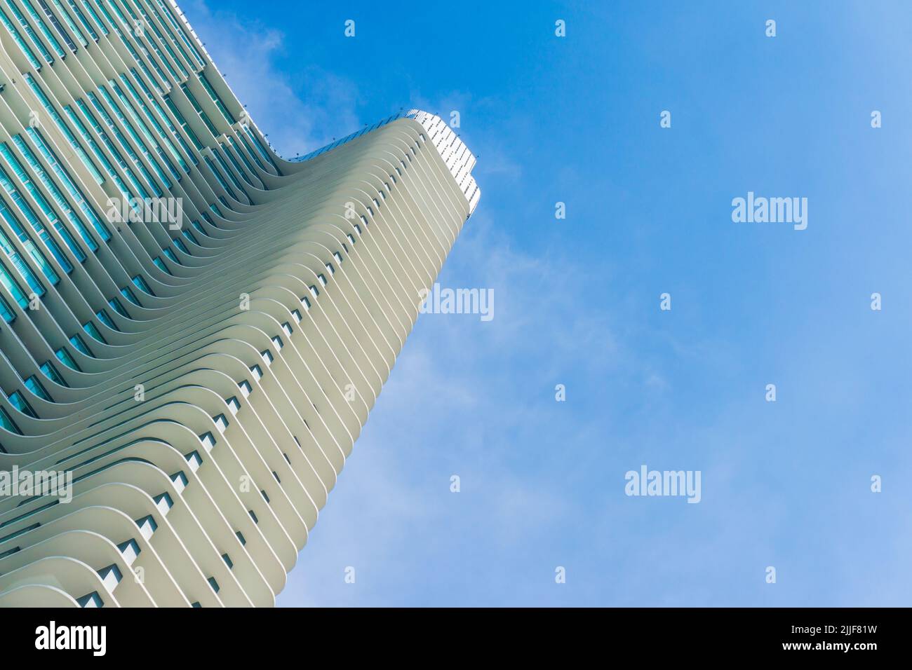 High rise skyscraper modern building against blue sky background ...