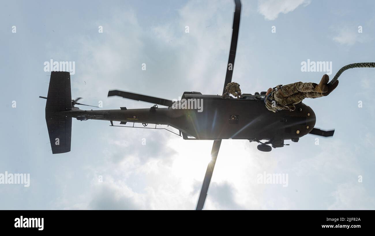 U.S. Army Special Forces conduct fast rope insertion training with the ...