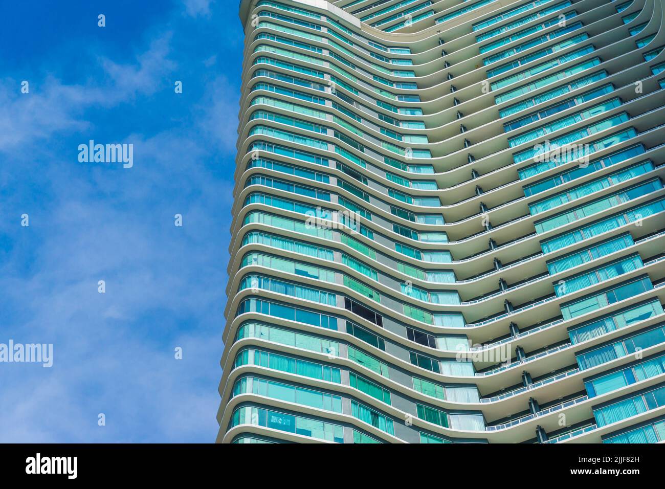 High rise skyscraper modern building against blue sky background ...