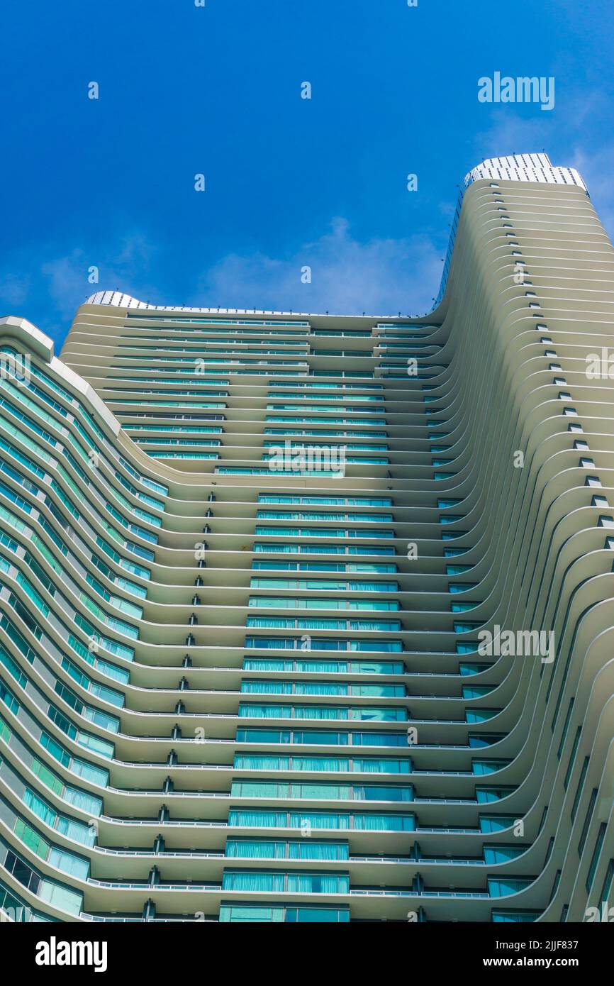 High rise skyscraper modern building against blue sky background ...