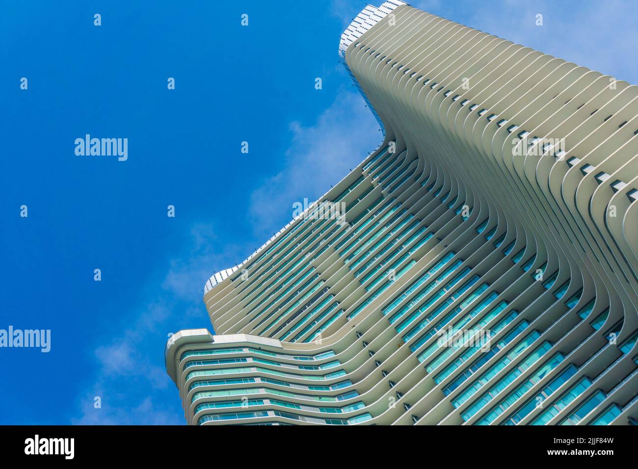 High rise skyscraper modern building against blue sky background ...