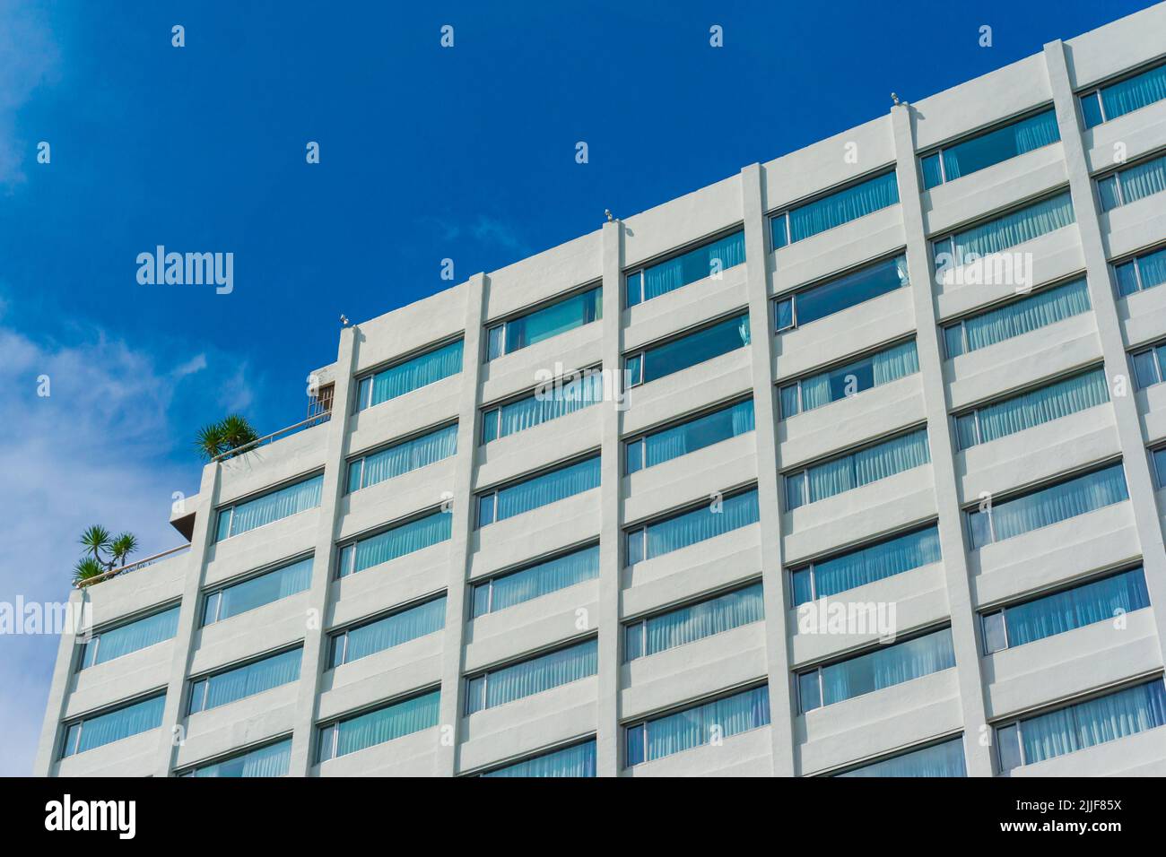 High rise skyscraper modern building against blue sky background ...