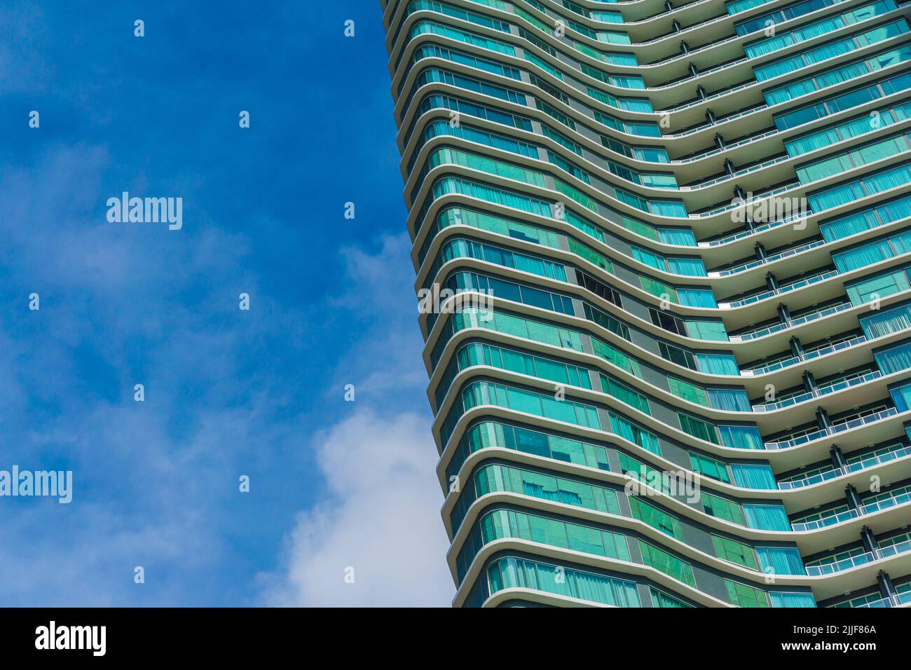 High rise skyscraper modern building against blue sky background ...