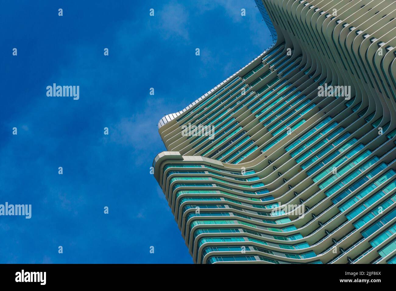 High rise skyscraper modern building against blue sky background ...