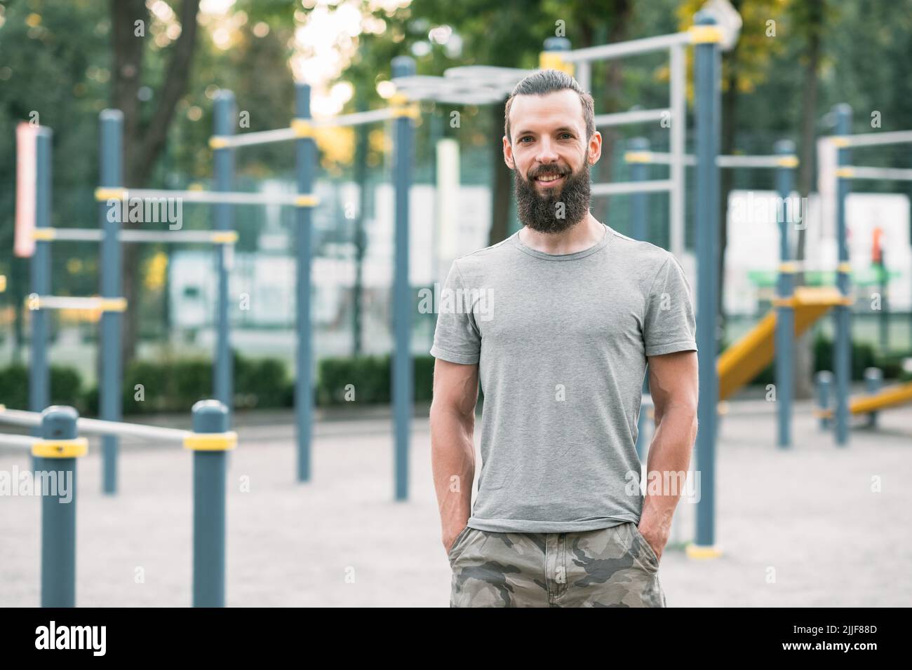 strength power outdoor workout man athletic field Stock Photo - Alamy