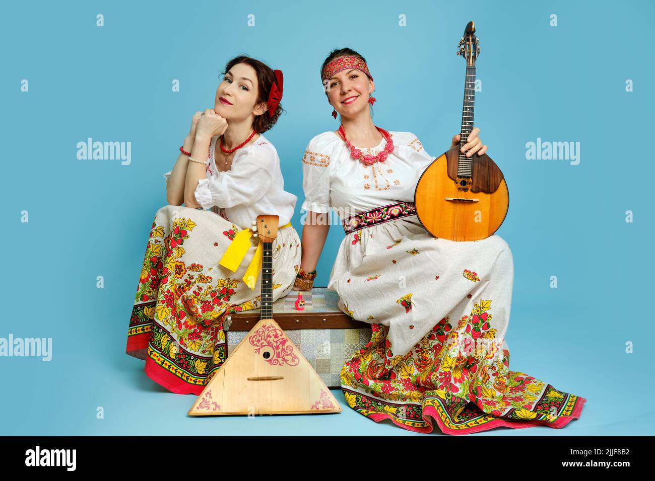 Women musicians in Russian folk dresses with musical instruments on a ...