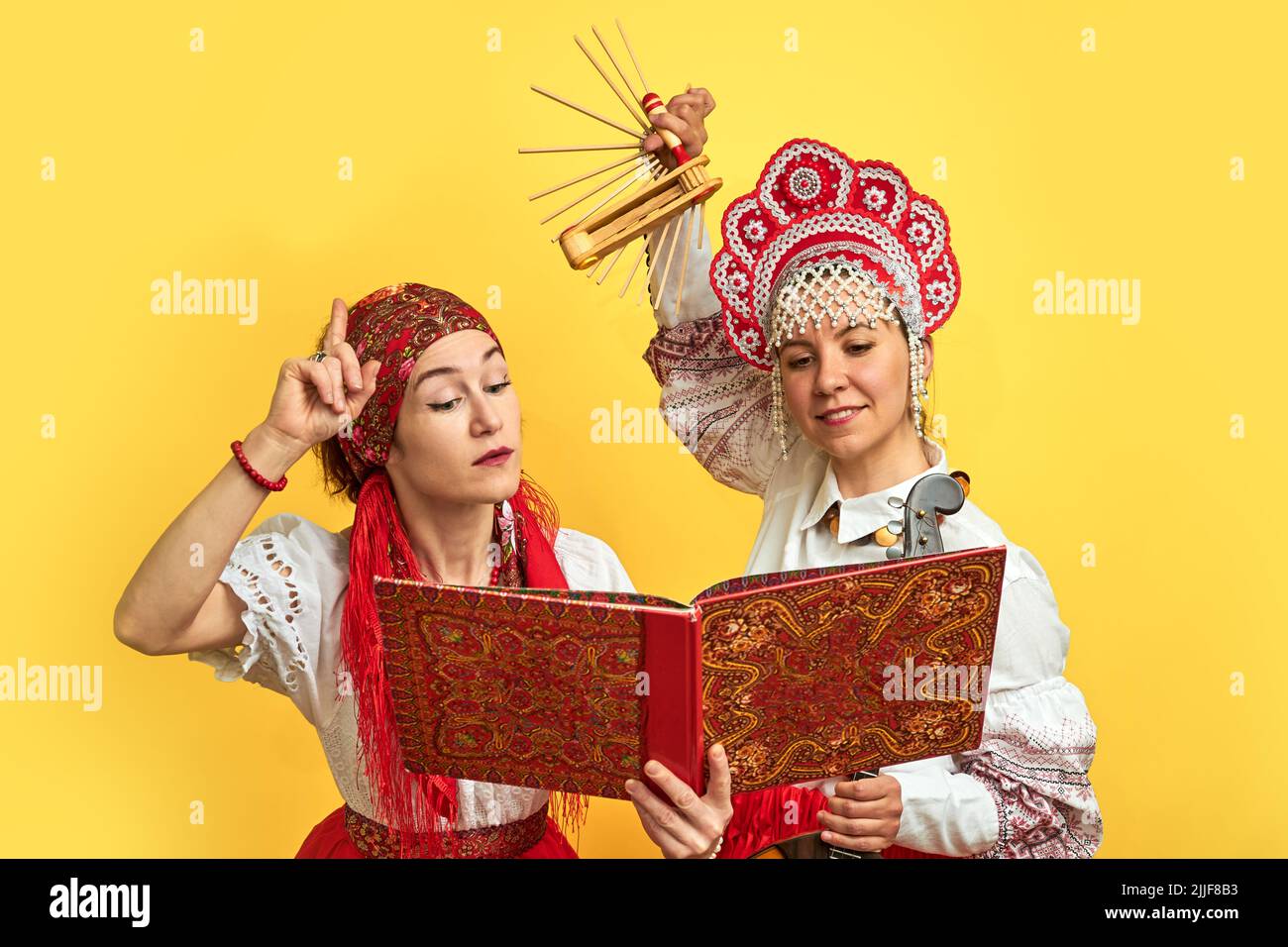 Women musicians in Russian folk dresses with musical instruments on a ...