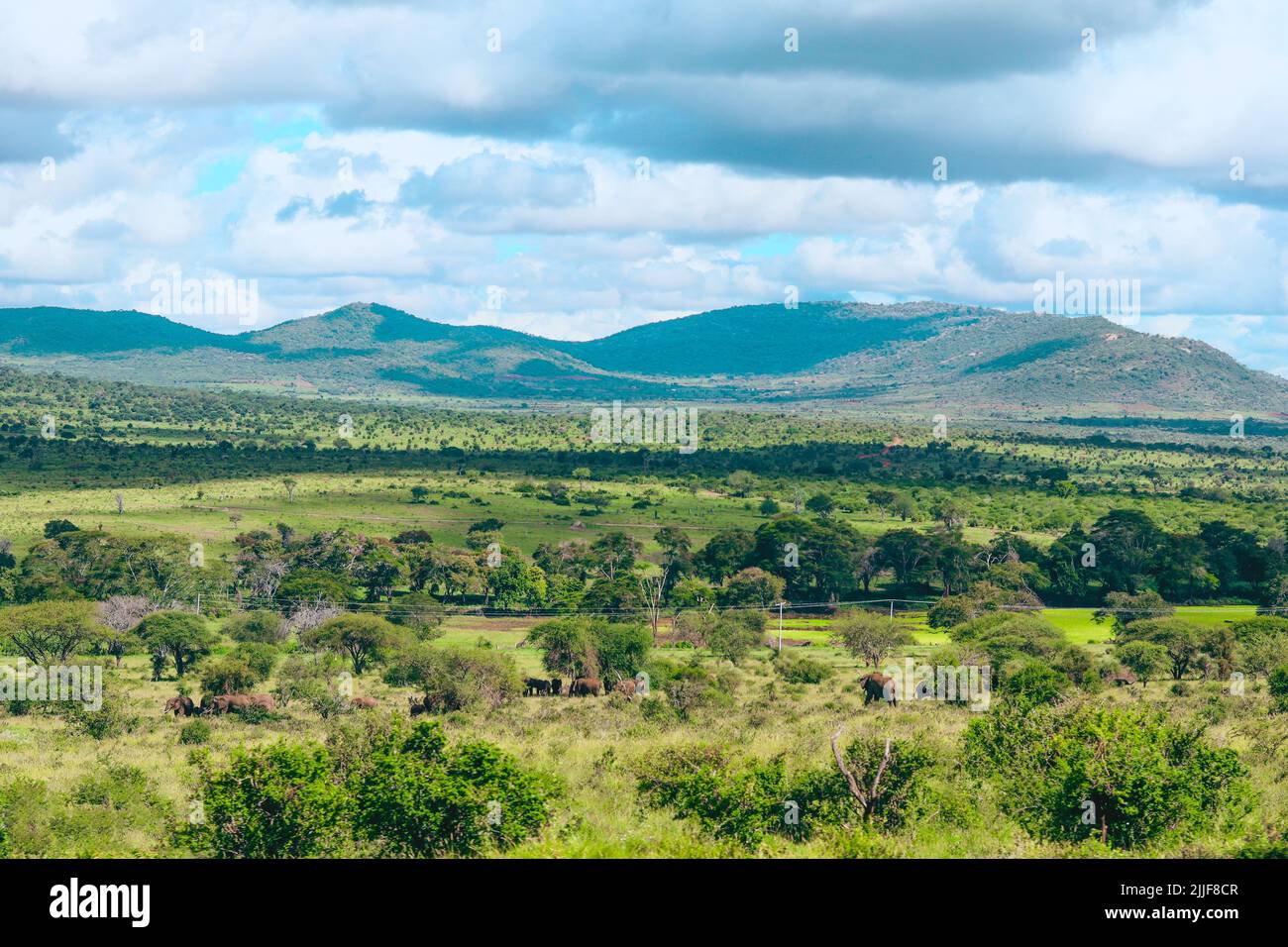 A beautiful shot of the Taita Hills in Kenya under a blue cloudy sky ...