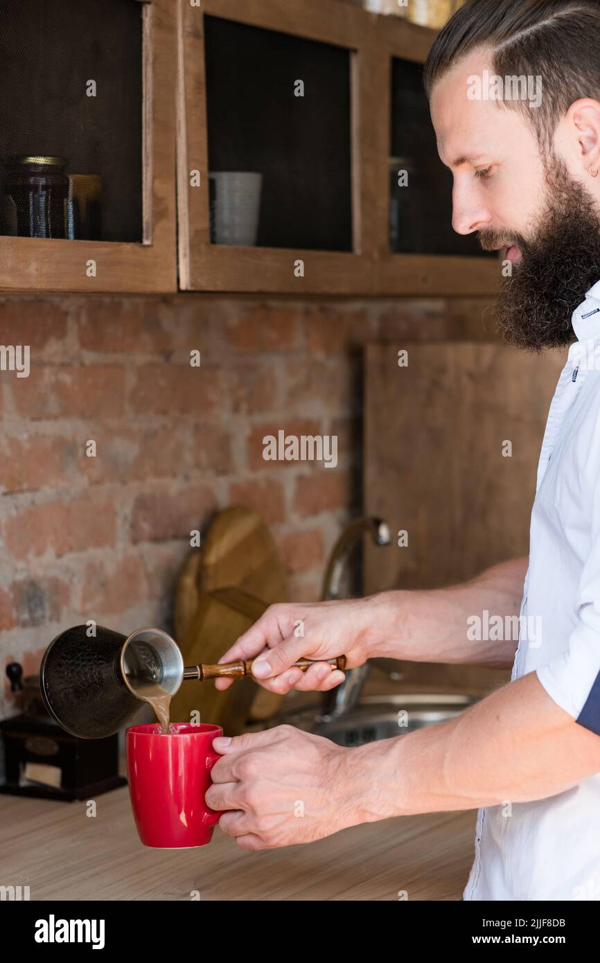Young man making coffee home kitchen hi-res stock photography and ...