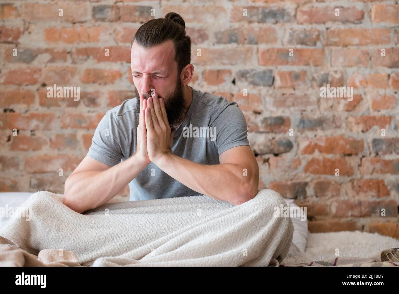bad night sleep stress insomnia man yawning Stock Photo - Alamy