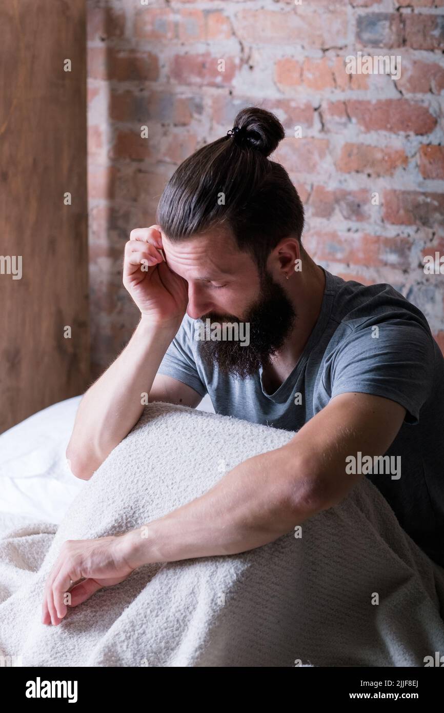 monday morning drowsiness man bed tired sleepy Stock Photo - Alamy