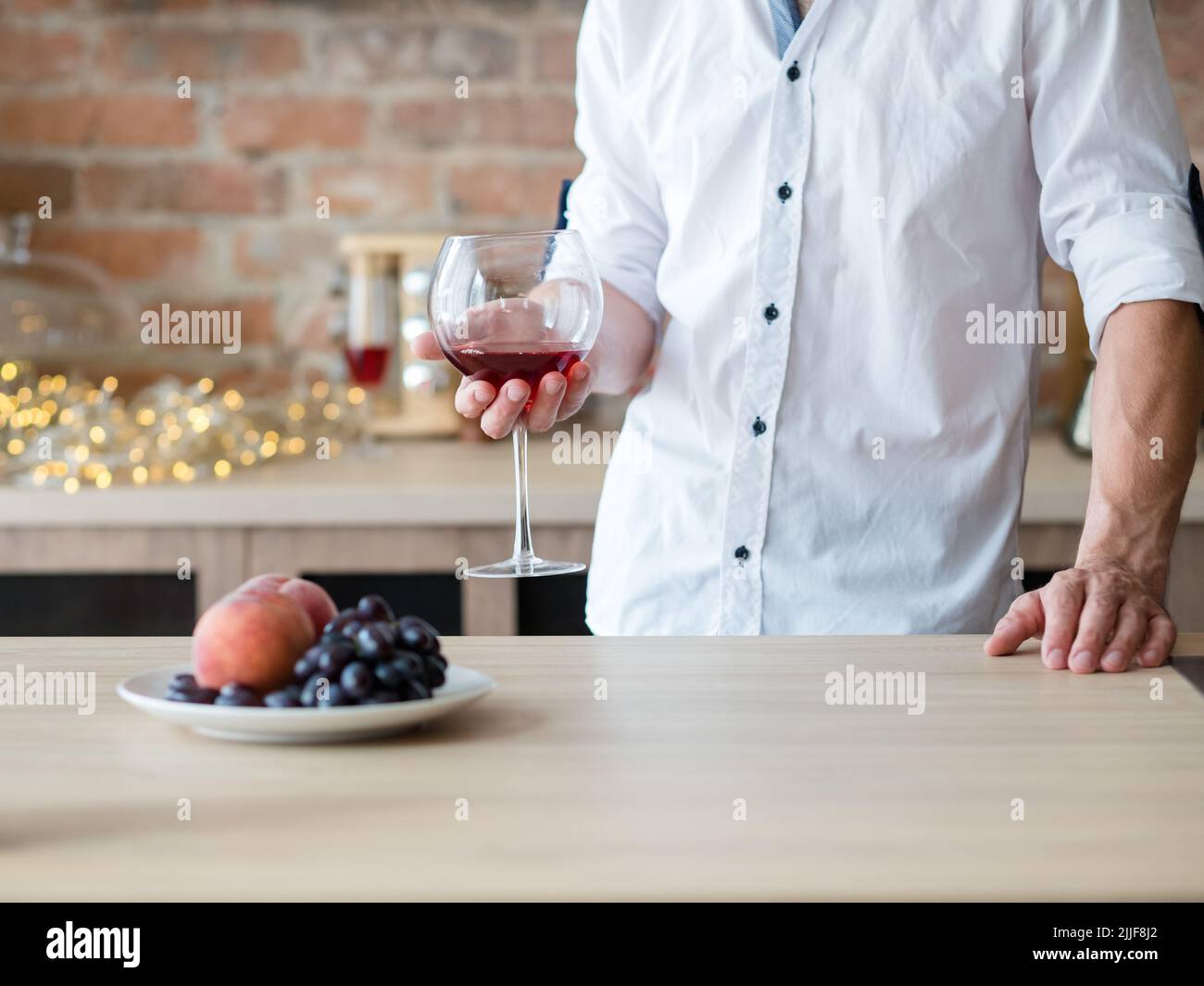 man white shirt glass red wine eat habit gourmet Stock Photo - Alamy