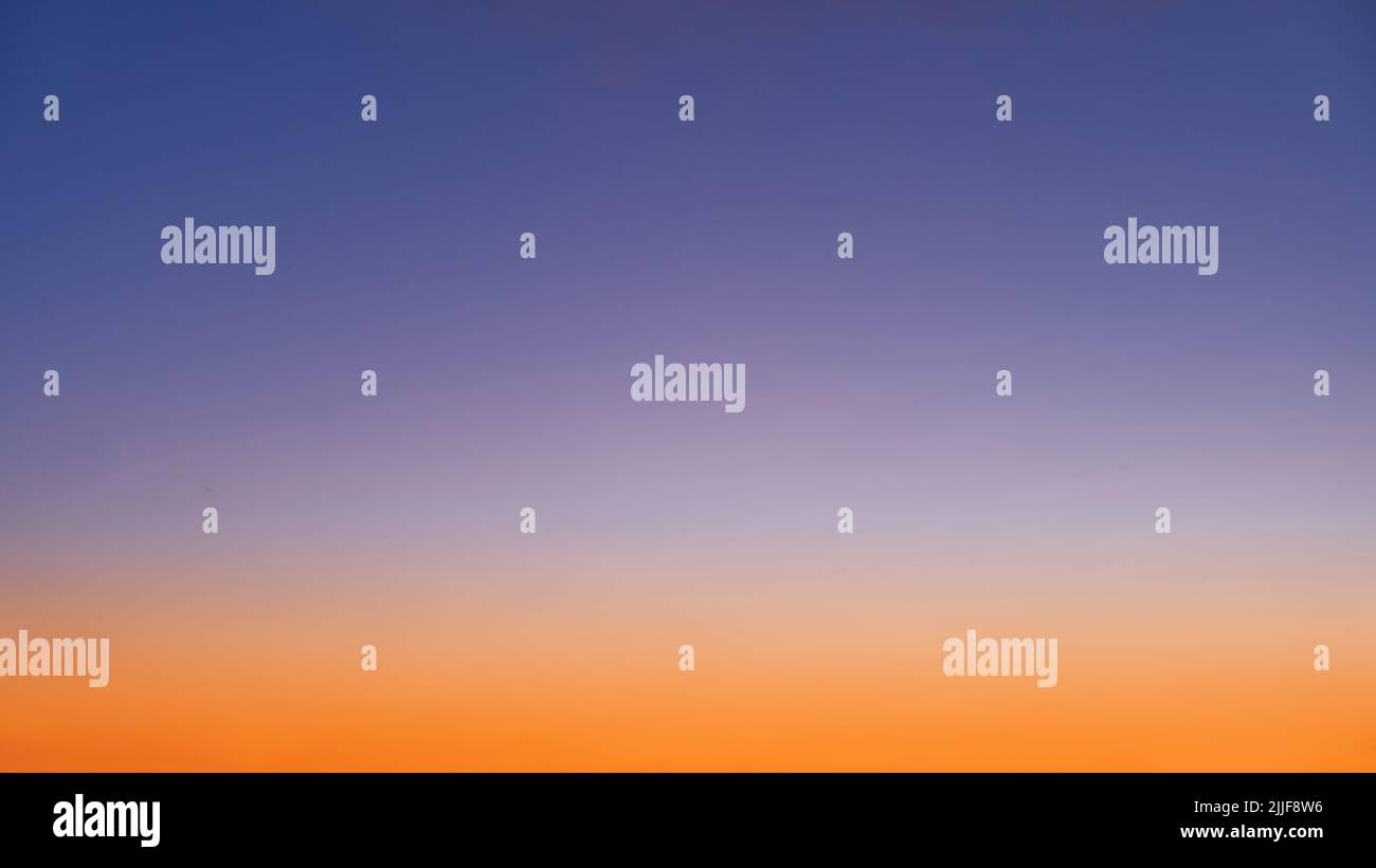 Gradient of orange-blue evening sky without clouds at sunset Stock ...