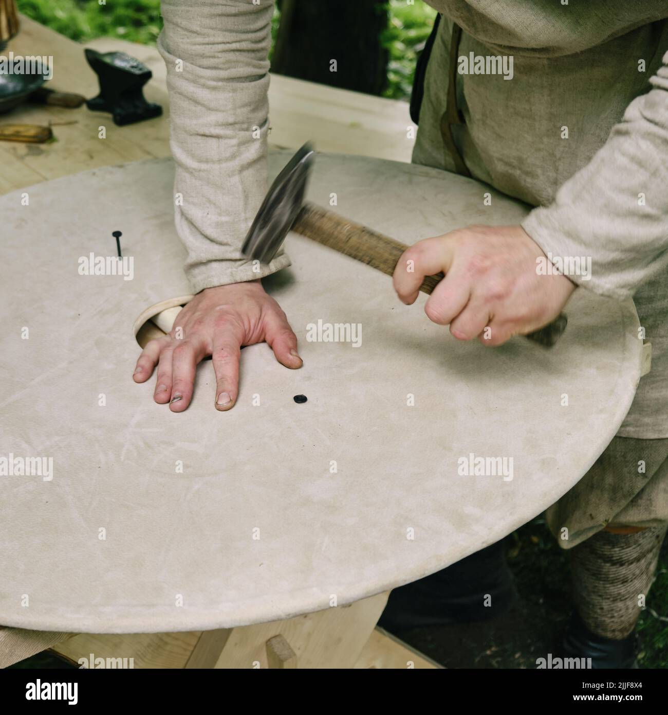 Making medieval shields made of wood and leather to protect soldiers in ...