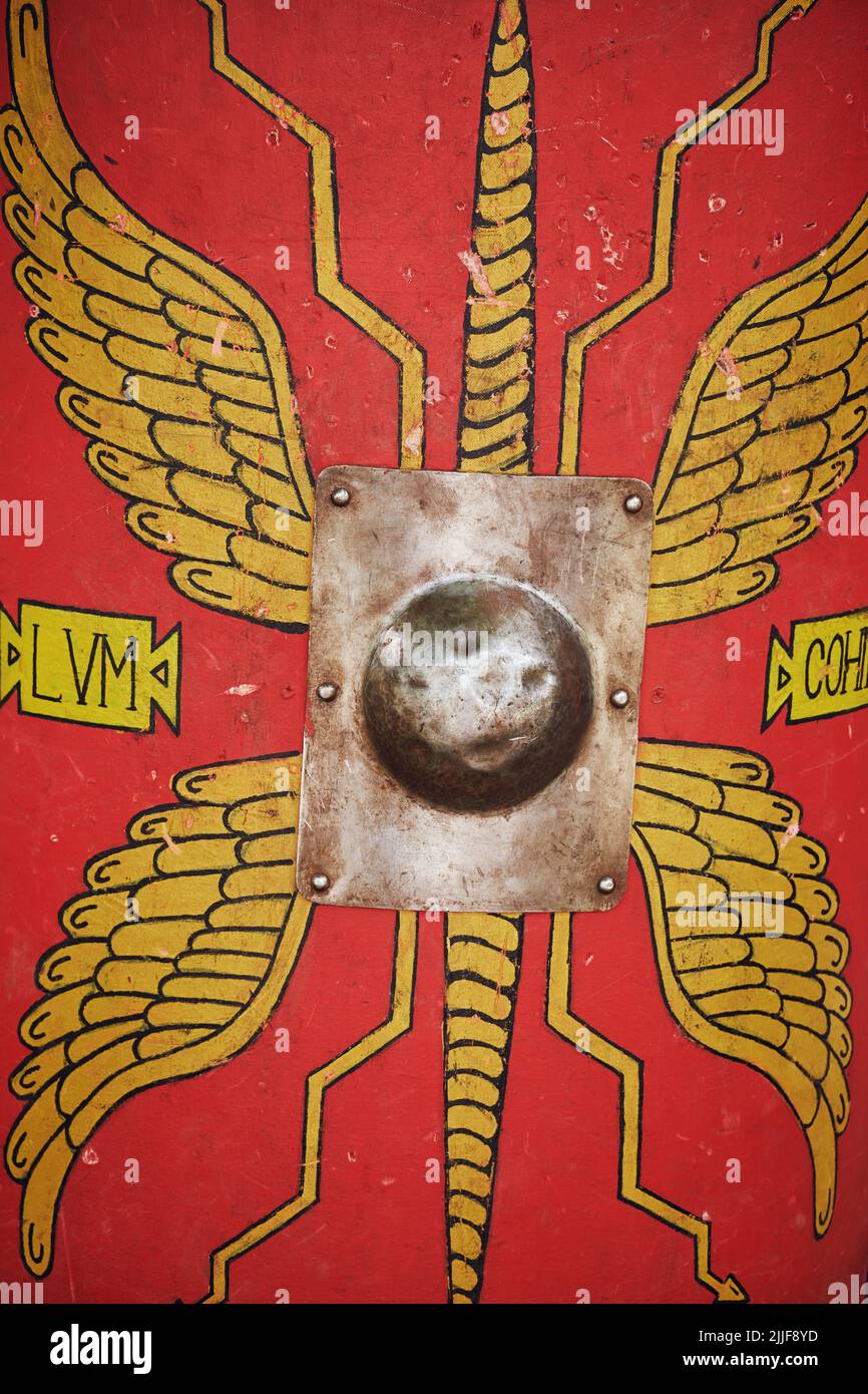 Red vintage shield of an ancient Roman warrior. Reconstruction of ...