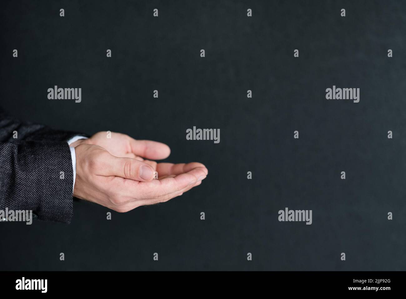 man holding invisible object hand palm advertising Stock Photo - Alamy