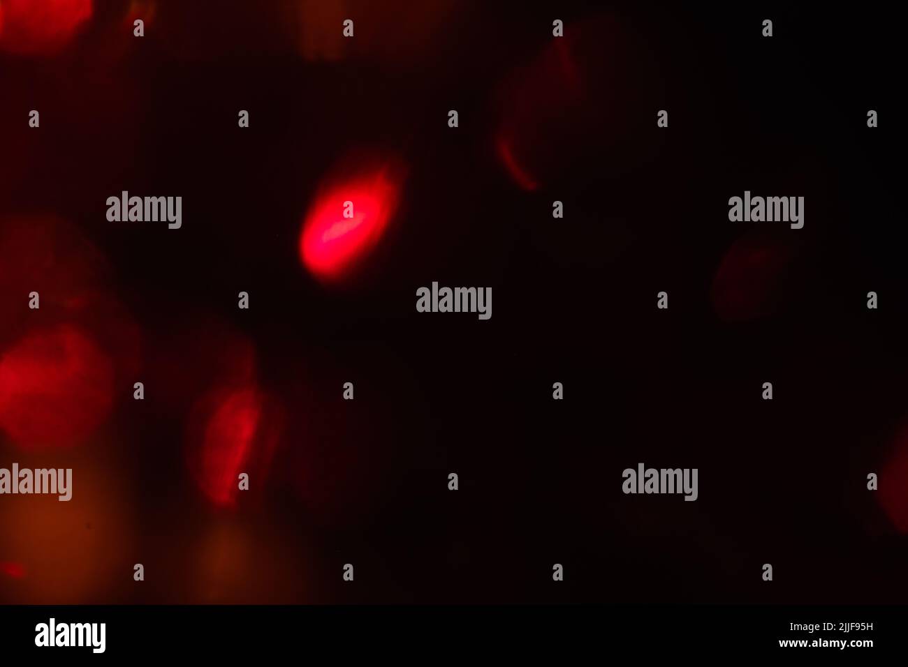 abstract lens flare background festive red blur Stock Photo - Alamy