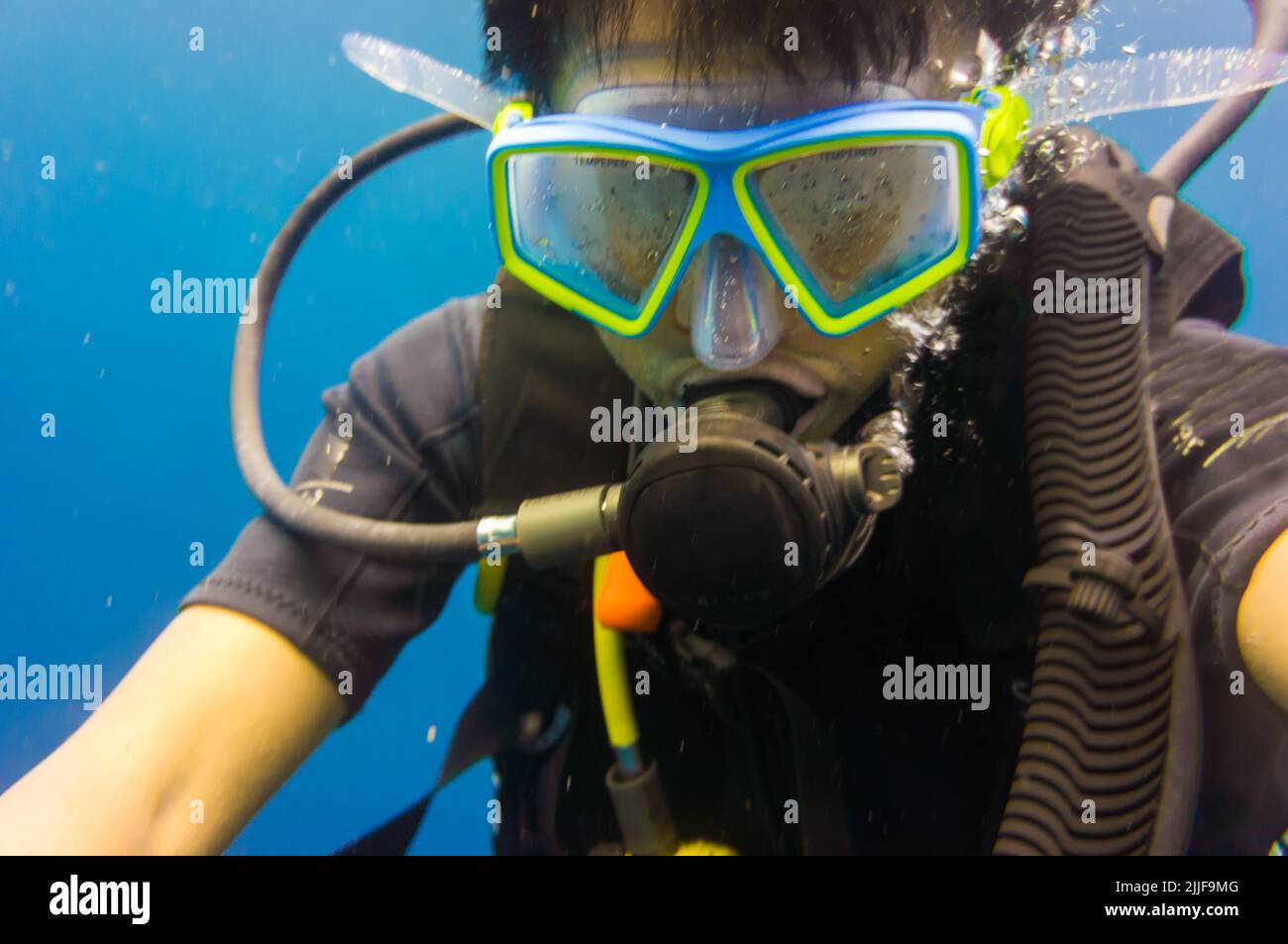 Scuba diving man with mask and underwater wetsuit take selfies photo ...